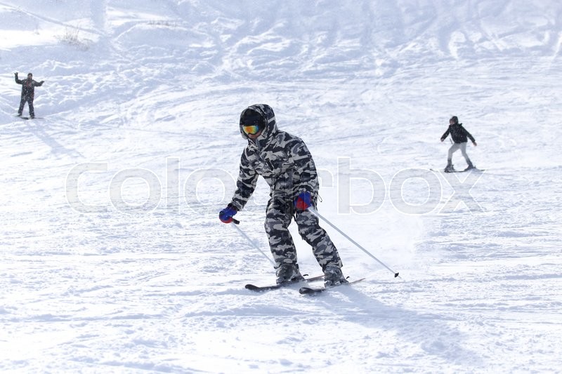 People skiing in the snow in the winter | Stock image | Colourbox