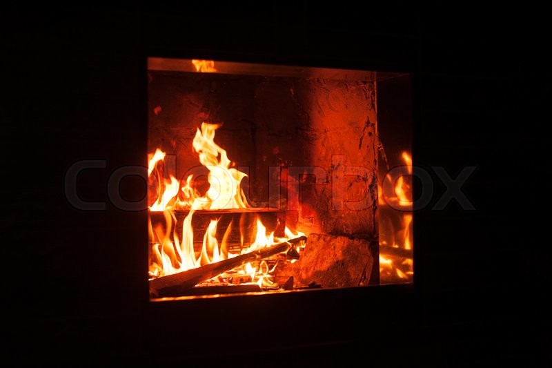 Roaring flames in a modern fireplace ... | Stock Photo | Colourbox