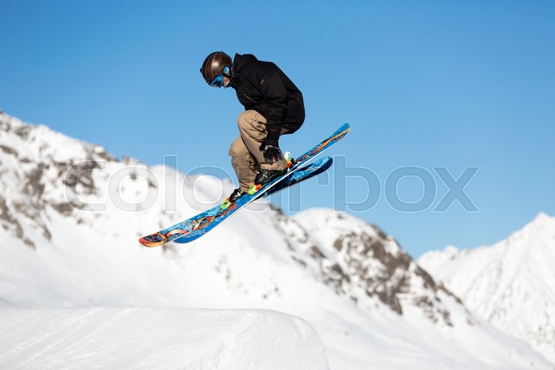 Skier performing a jump trick in ski ... | Stock image | Colourbox