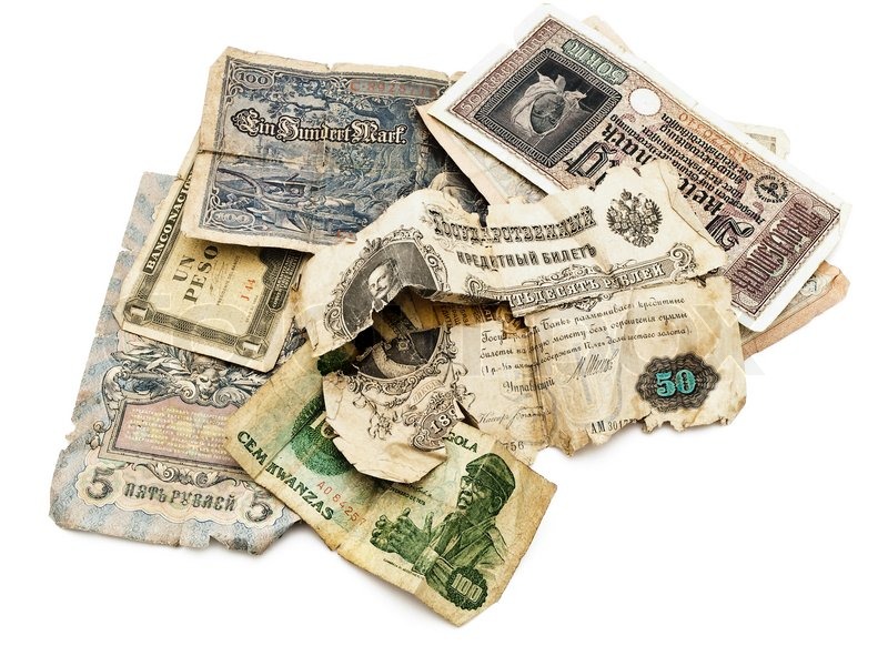 Different old paper currency over the ... | Stock Photo | Colourbox