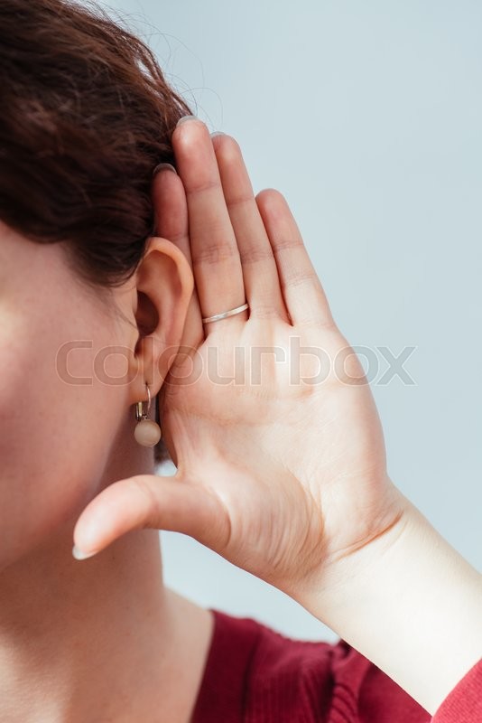 Portrait of woman overhearing a ... | Stock image | Colourbox