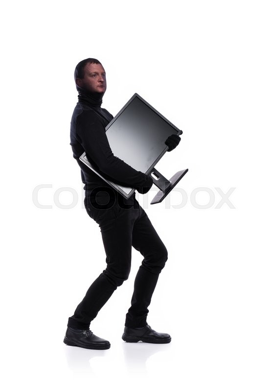 Thief in action stealing information ... | Stock image | Colourbox