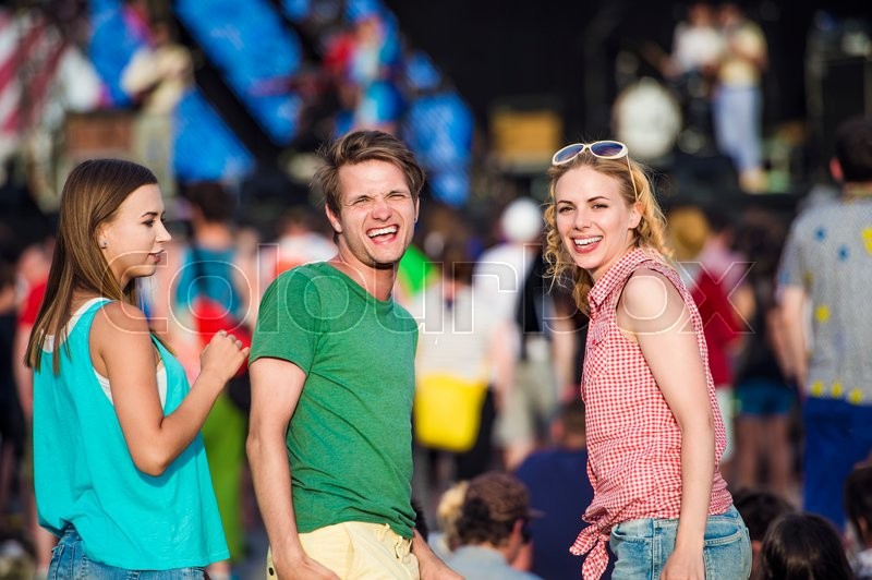 Group of beautiful teens at concert at ... | Stock image | Colourbox