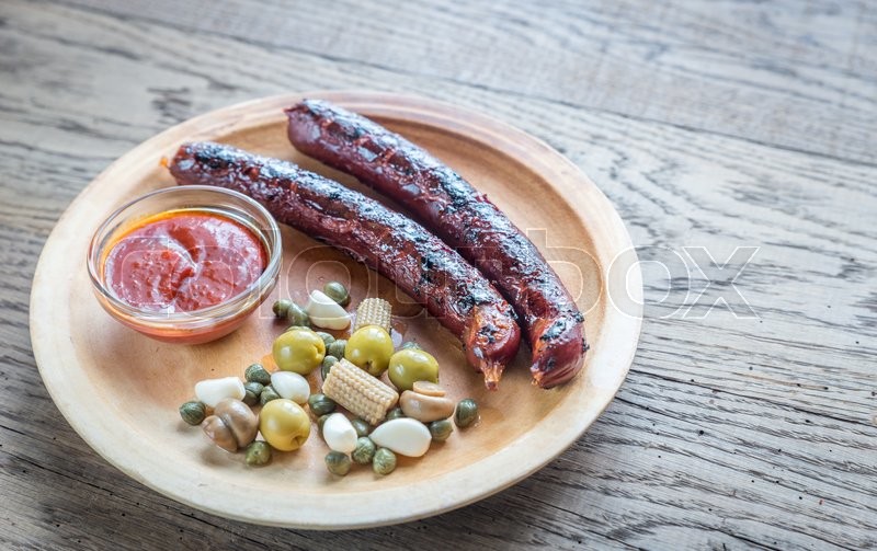 Grilled sausages with marinated ... | Stock image | Colourbox