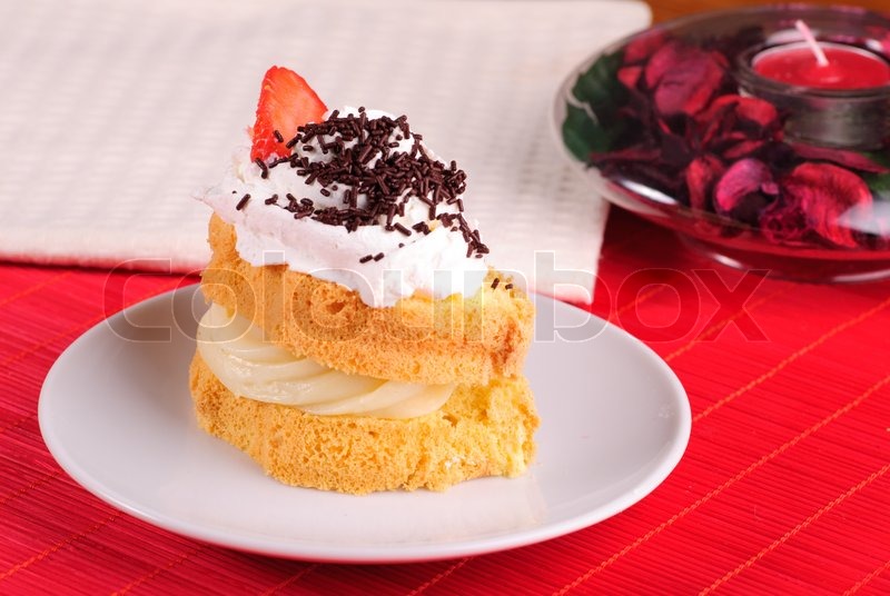 Sponge cake with custard and whipped ... | Stock image | Colourbox