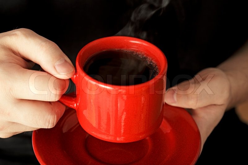 Red cup of steaming hot black coffee | Stock image | Colourbox
