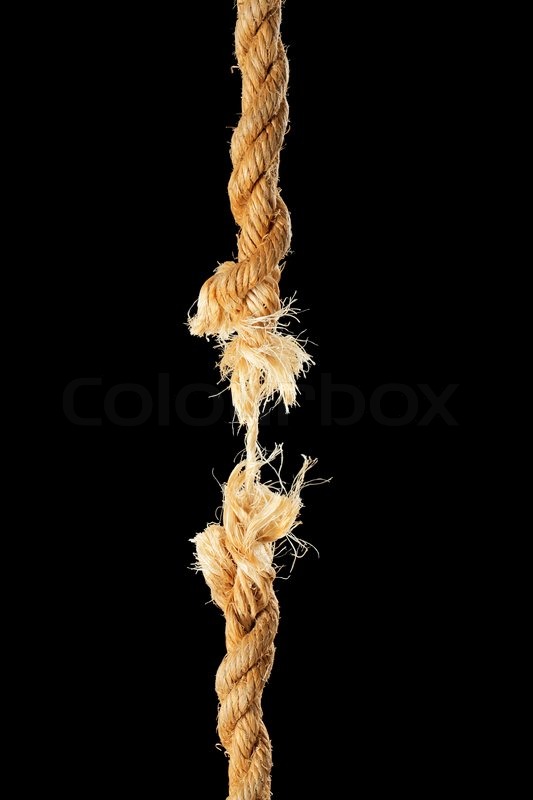 Breaking rope on black background | Stock image | Colourbox