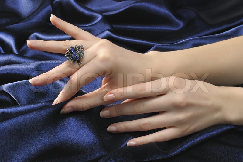 Close-up woman's hands with ring on ... | Stock image | Colourbox