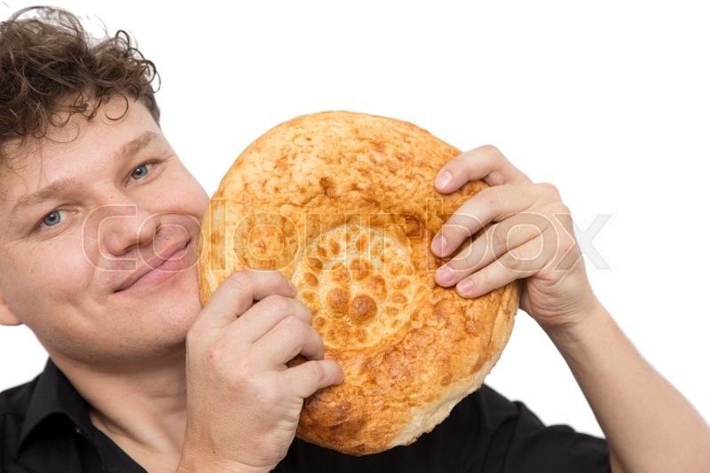 Man with bread on a white background | Stock image | Colourbox