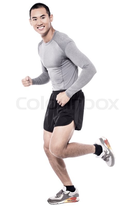 Young sports man jogging on white ... | Stock image | Colourbox