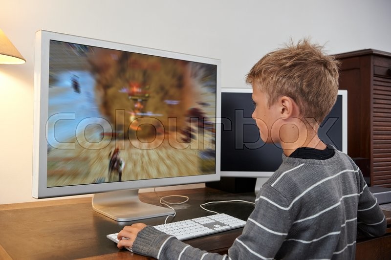 Child playing online games in computer | Stock image | Colourbox