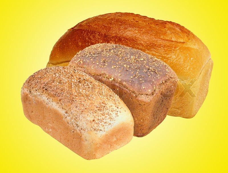 Fresh wheat bread over yellow ... | Stock image | Colourbox