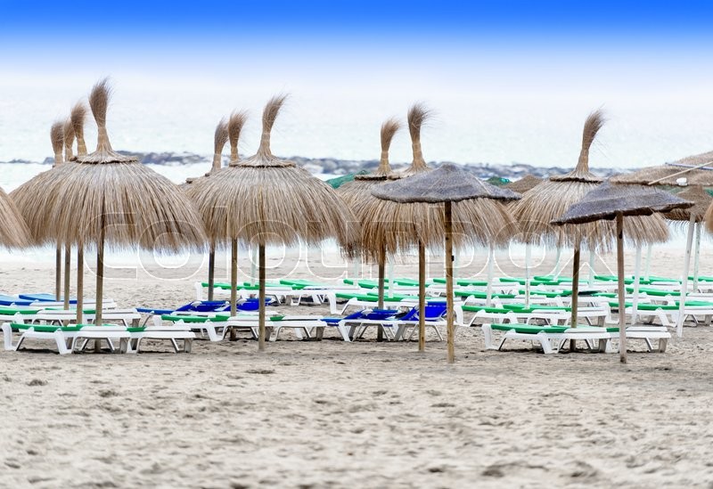 Sunbathing benches at beach | Stock image | Colourbox