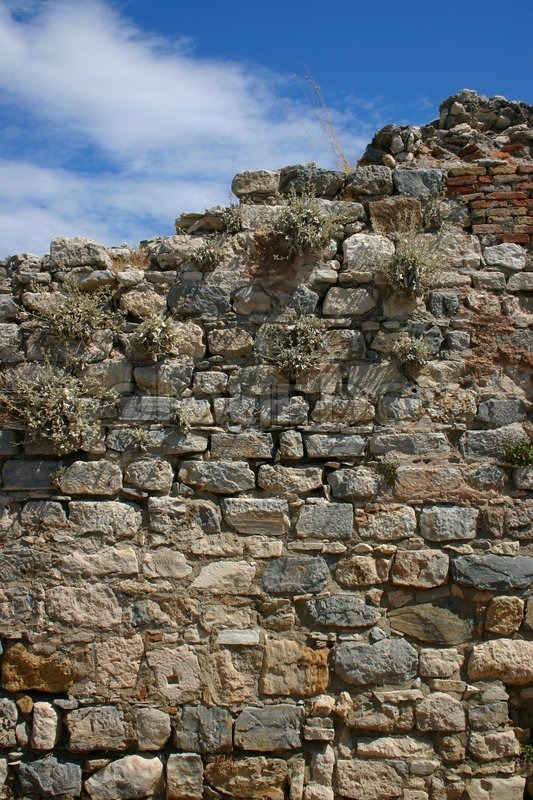 Ancient stone wall top and blue sky ... | Stock image | Colourbox
