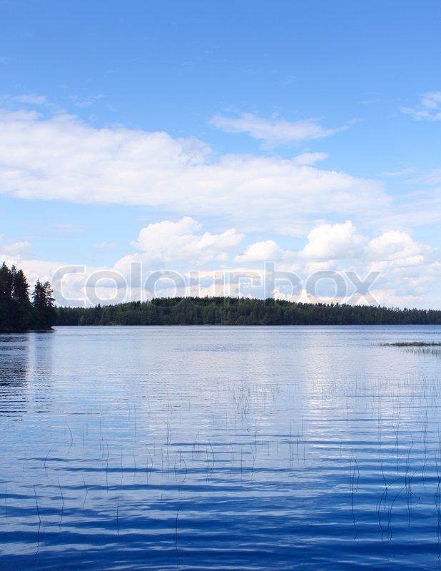 Calm blue lake with blue sky white ... | Stock image | Colourbox