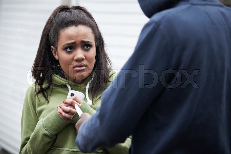 Thief Stealing Teenage Girl's Mobile ... | Stock image | Colourbox