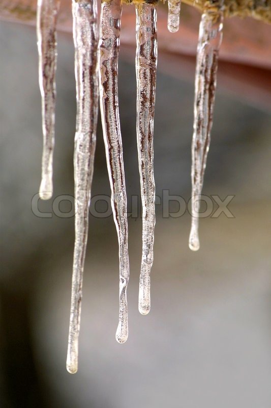 Close-up long icicles on the wooden ... | Stock image | Colourbox