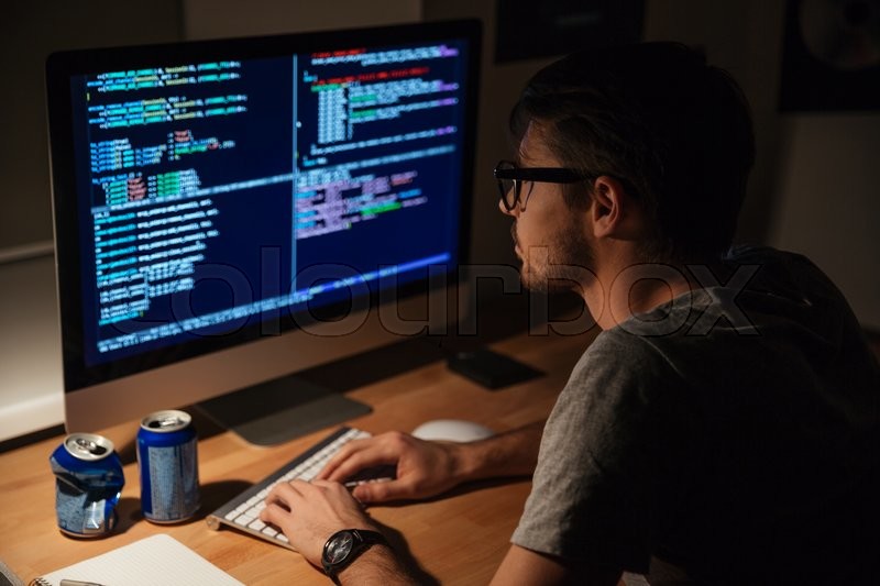 Thoughtful young programmer coding on ... | Stock image | Colourbox Thoughtful young programmer coding on ... | Stock image | Colourbox