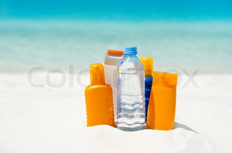Water and sun protection cream on beach ... | Stock image | Colourbox