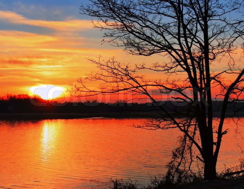 Sunset over the lake in early spring | Stock image | Colourbox