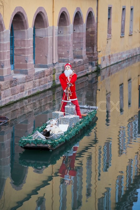 Santa claus on a boat in the center of ... | Stock image | Colourbox