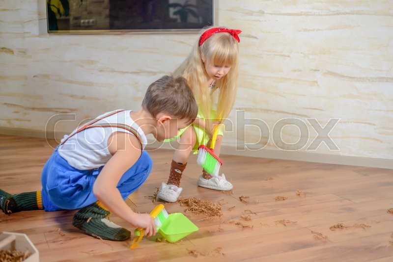 Young boy and girl helping to clean ... | Stock image | Colourbox
