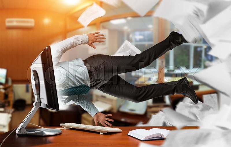Man is being pulling into the computer ... | Stock image | Colourbox