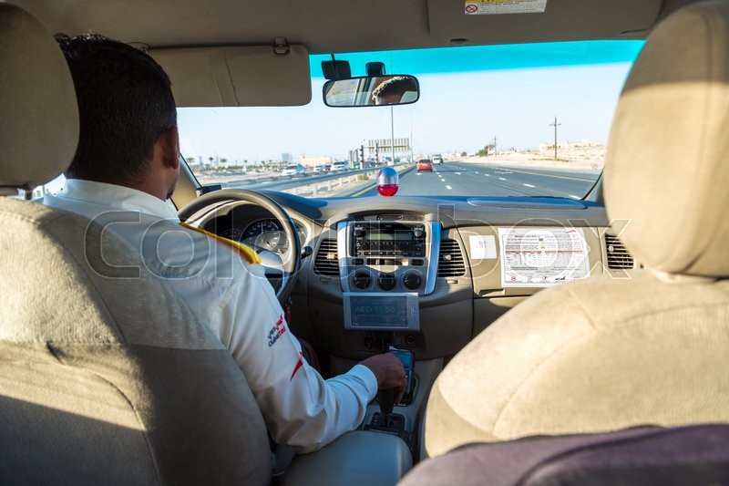 DUBAI, UAE - NOVEMBER 24 : Taxi driver ... | Stock image | Colourbox