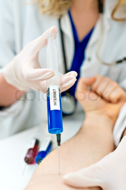 Doctor injecting patient with syringe. ... | Stock image | Colourbox
