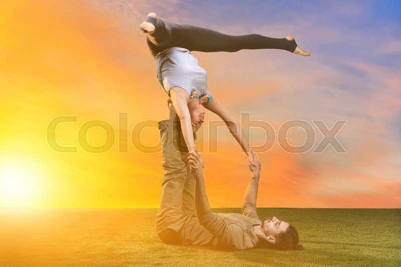 The two people doing yoga exercises ... | Stock image | Colourbox