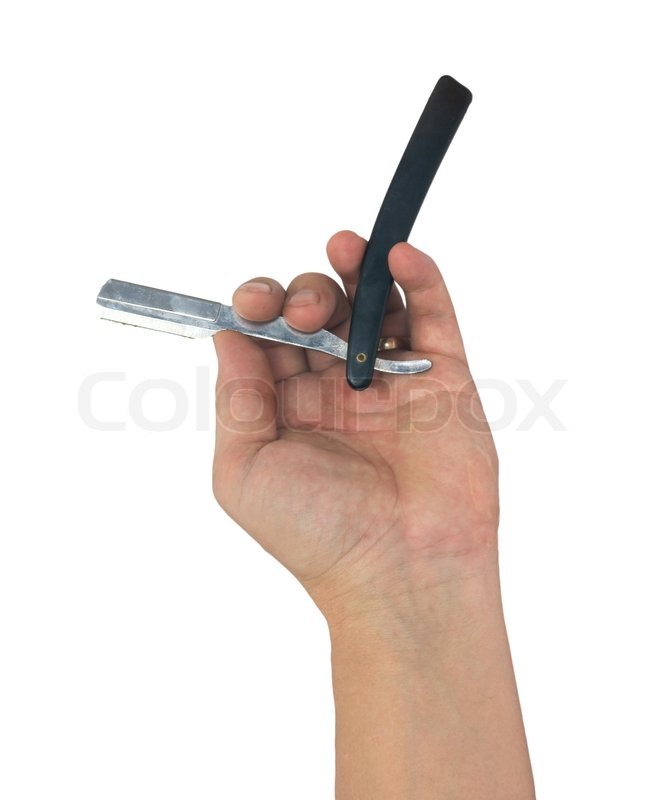Hand holding classic straight razor on ... | Stock image | Colourbox