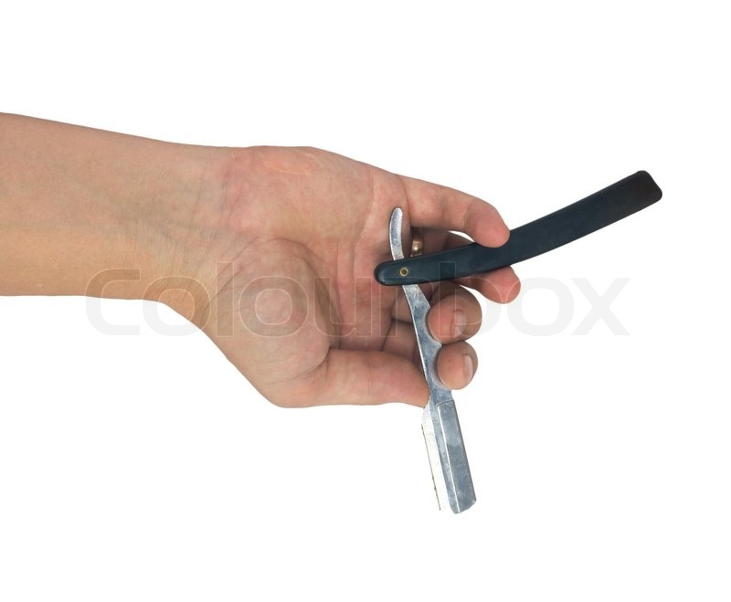 Hand holding classic straight razor on ... | Stock Photo | Colourbox