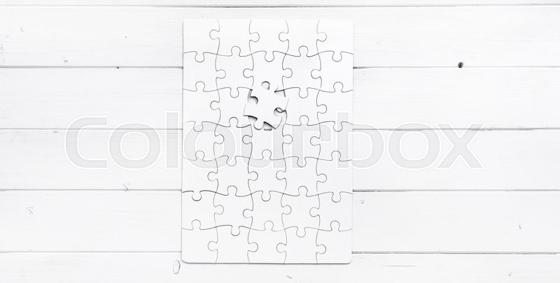 White completed puzzle with one undone ... | Stock image | Colourbox