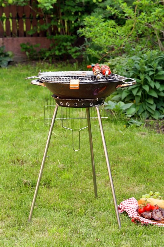Round metal barbecue grill appliance ... | Stock image | Colourbox