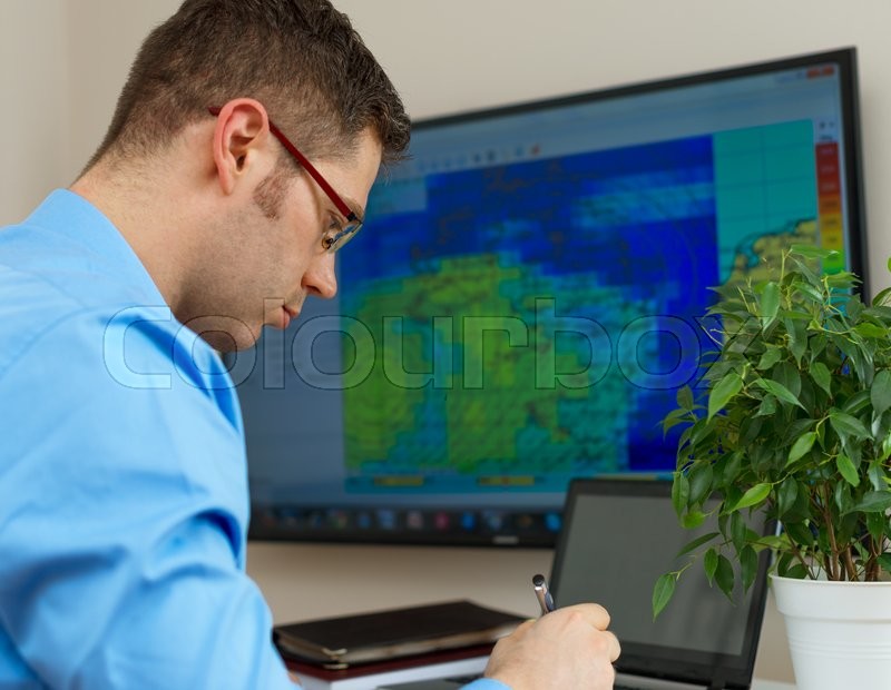 Handsome male meteorologist in glasses ... | Stock image | Colourbox