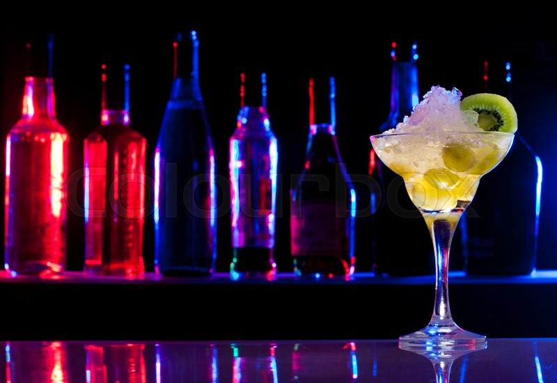 Cocktail drink with colorful light on ... | Stock image | Colourbox