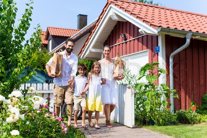 Family coming home from shopping ... | Stock image | Colourbox