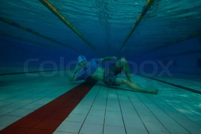 Happy man resting on the pool bottom - ... | Stock image | Colourbox