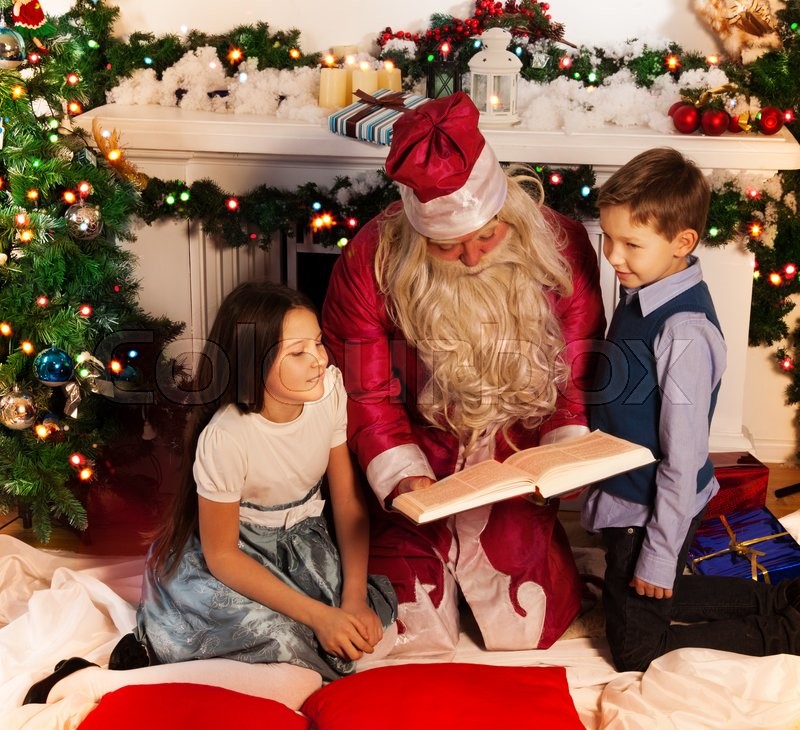 Santa Reading A Book To Children