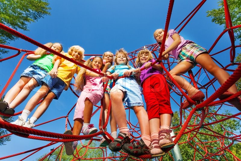 Children stand close on ropes of ... | Stock image | Colourbox