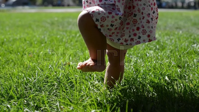 Little girl playing with a ball, legs | Stock video | Colourbox