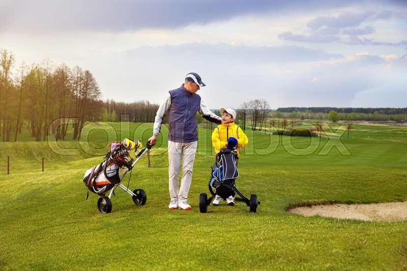 Father with son are training at golf ... | Stock image | Colourbox