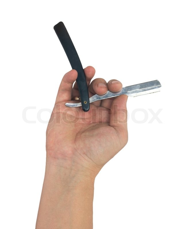 Hand holding classic straight razor on ... | Stock image | Colourbox