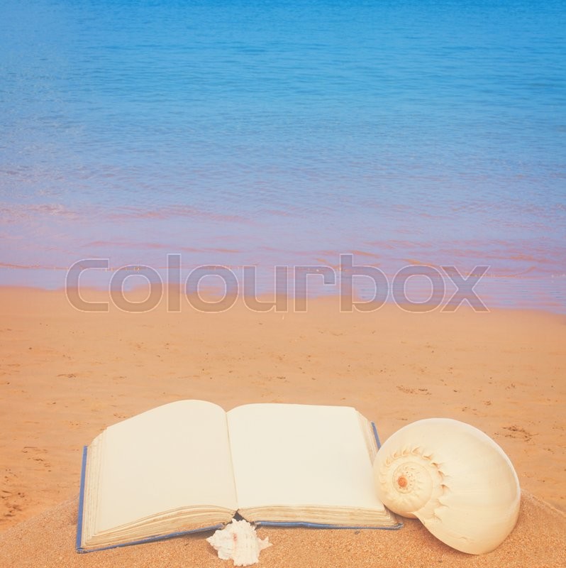 Open book on a sea shore - leisure ... | Stock image | Colourbox