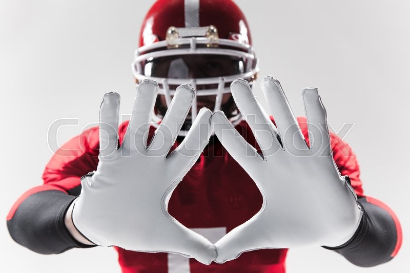 The hands of american football player ... | Stock image | Colourbox