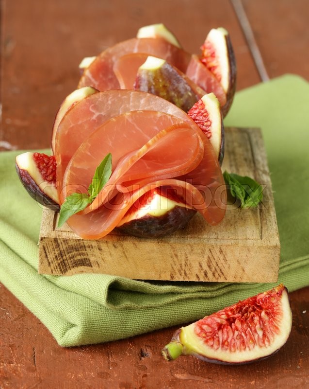 Ripe purple figs with smoked ham - a ... | Stock Photo | Colourbox