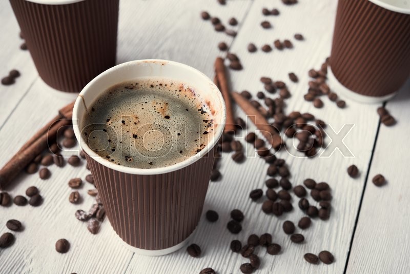 Tasty cup of coffee on white wooden ... | Stock image | Colourbox
