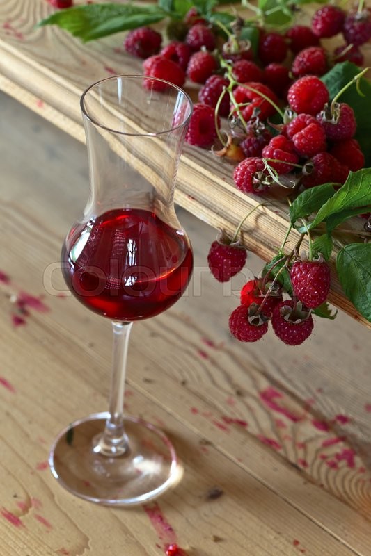 Raspberry wine and ripe berries with ... | Stock image | Colourbox
