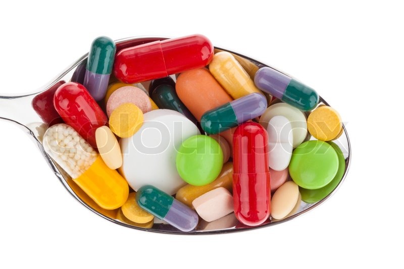 Many different colored tablets on a ... | Stock image | Colourbox