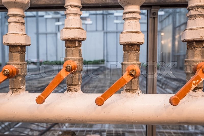 Factory pipes with orange handles for ... | Stock image | Colourbox